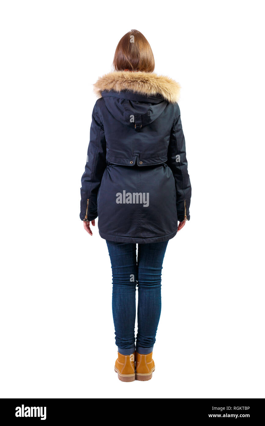 Back view woman in winter jacket looking up. Standing young girl in ...