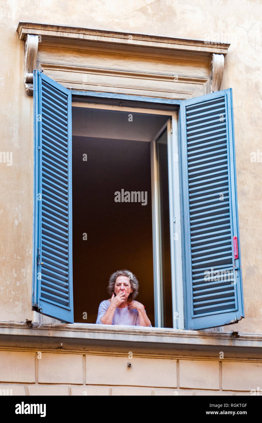 Woman smoking cigarette in rome hi-res stock photography and images - Alamy