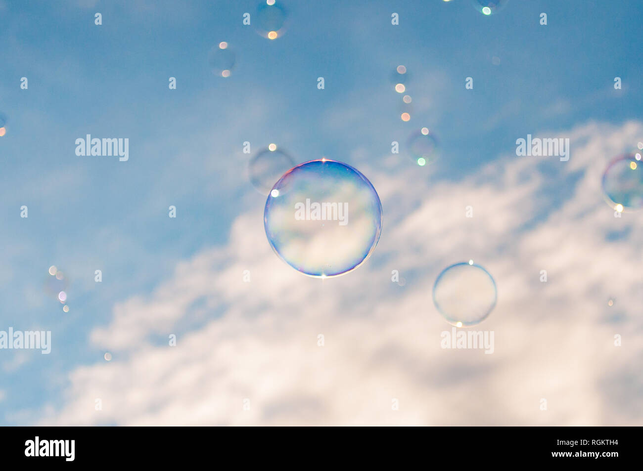 Light and colorful soap bubbles flying with the wind in the air to the ...