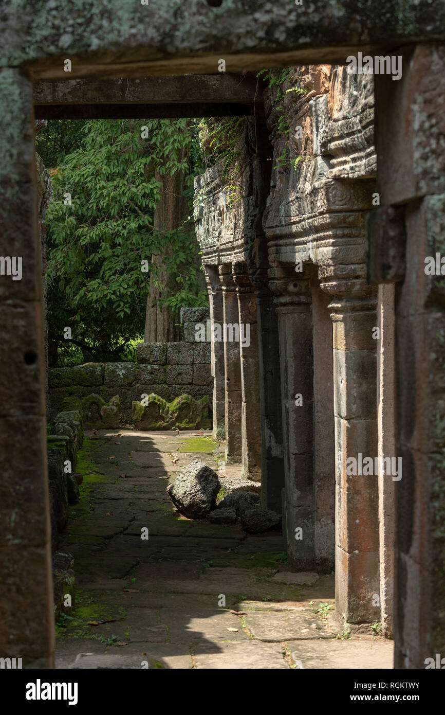 Wall of stone temple framed by arch Stock Photo - Alamy