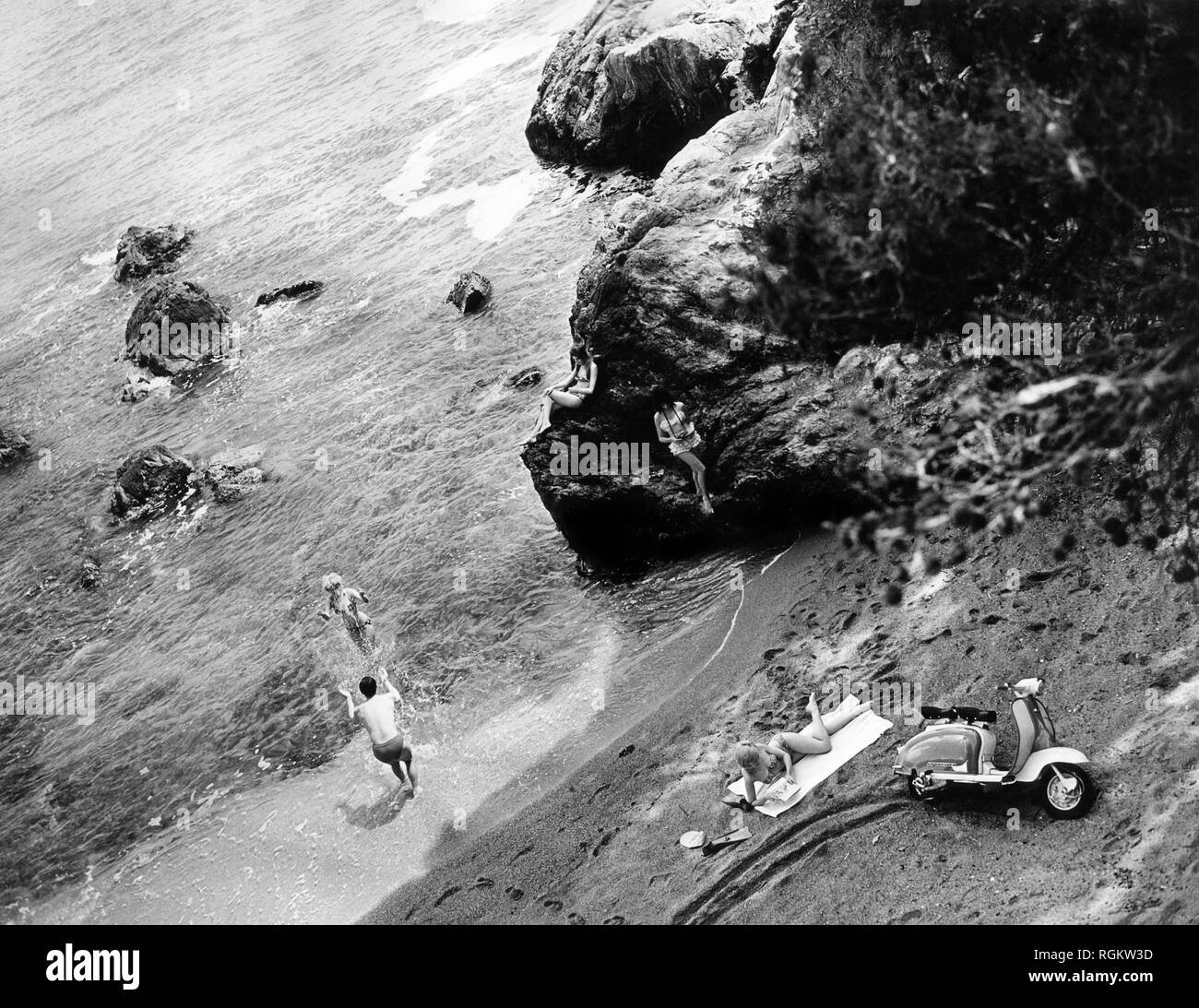 Two men on beach Black and White Stock Photos & Images - Alamy