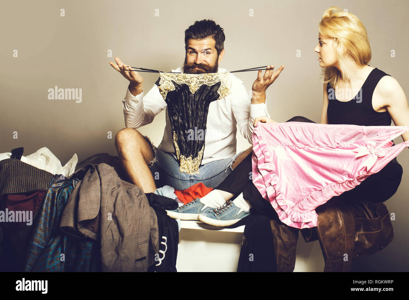 young couple in bath with clothes Stock Photo - Alamy