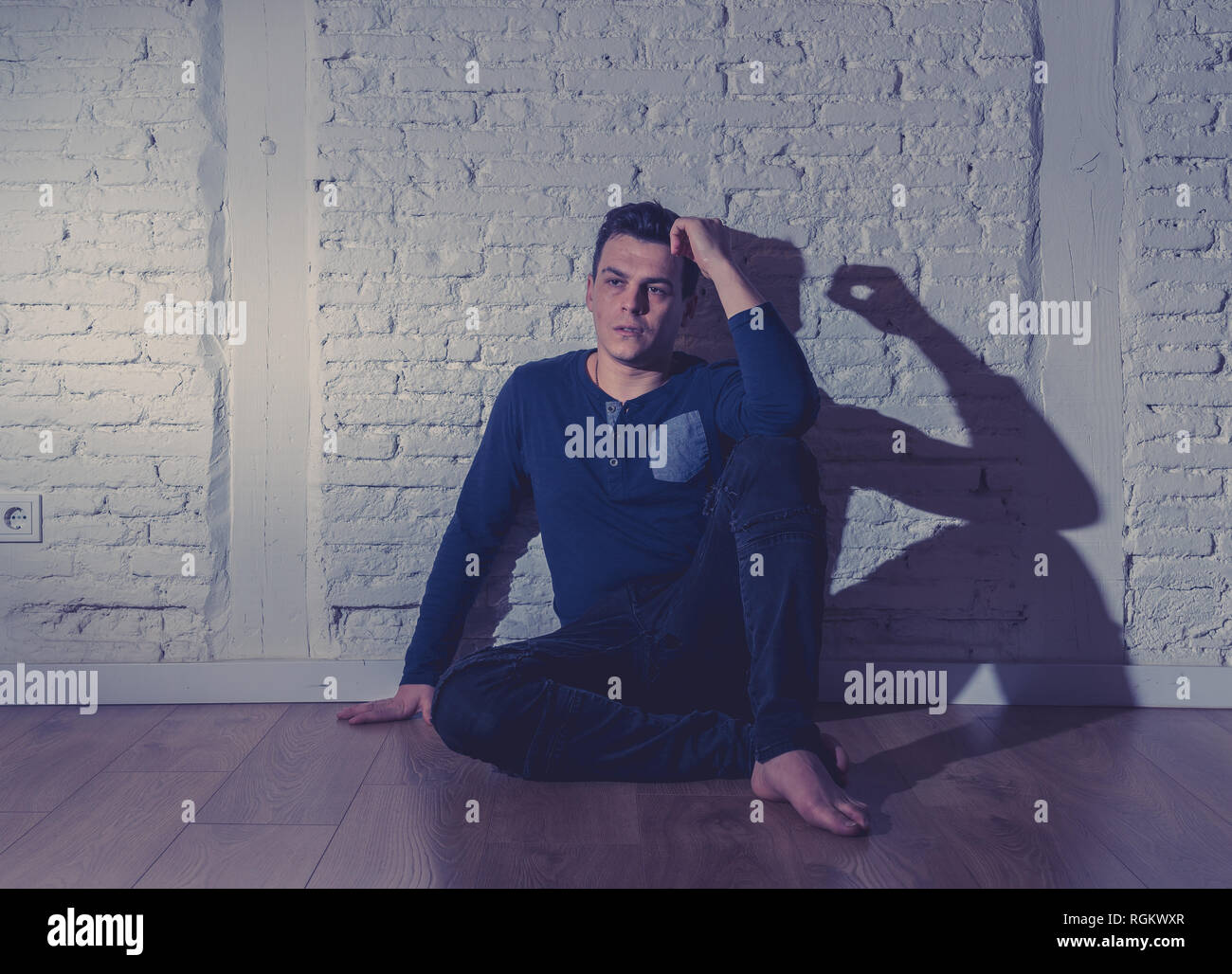 Portrait of sad depressed young man crying devastated feeling hurt ...