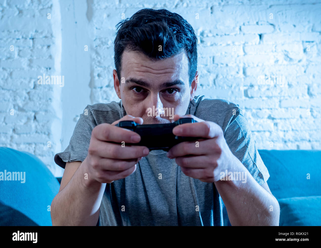 Portrait of young student man spending time playing video games using ...