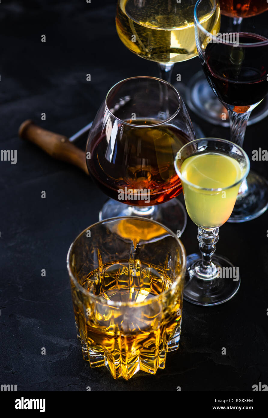 Set of glasses with alcohol drinks on dark background with copy space ...