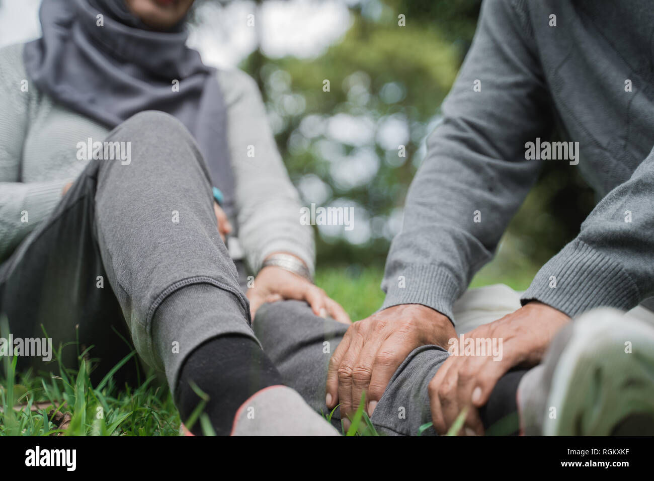 senior's hand giving massage on leg Stock Photo - Alamy