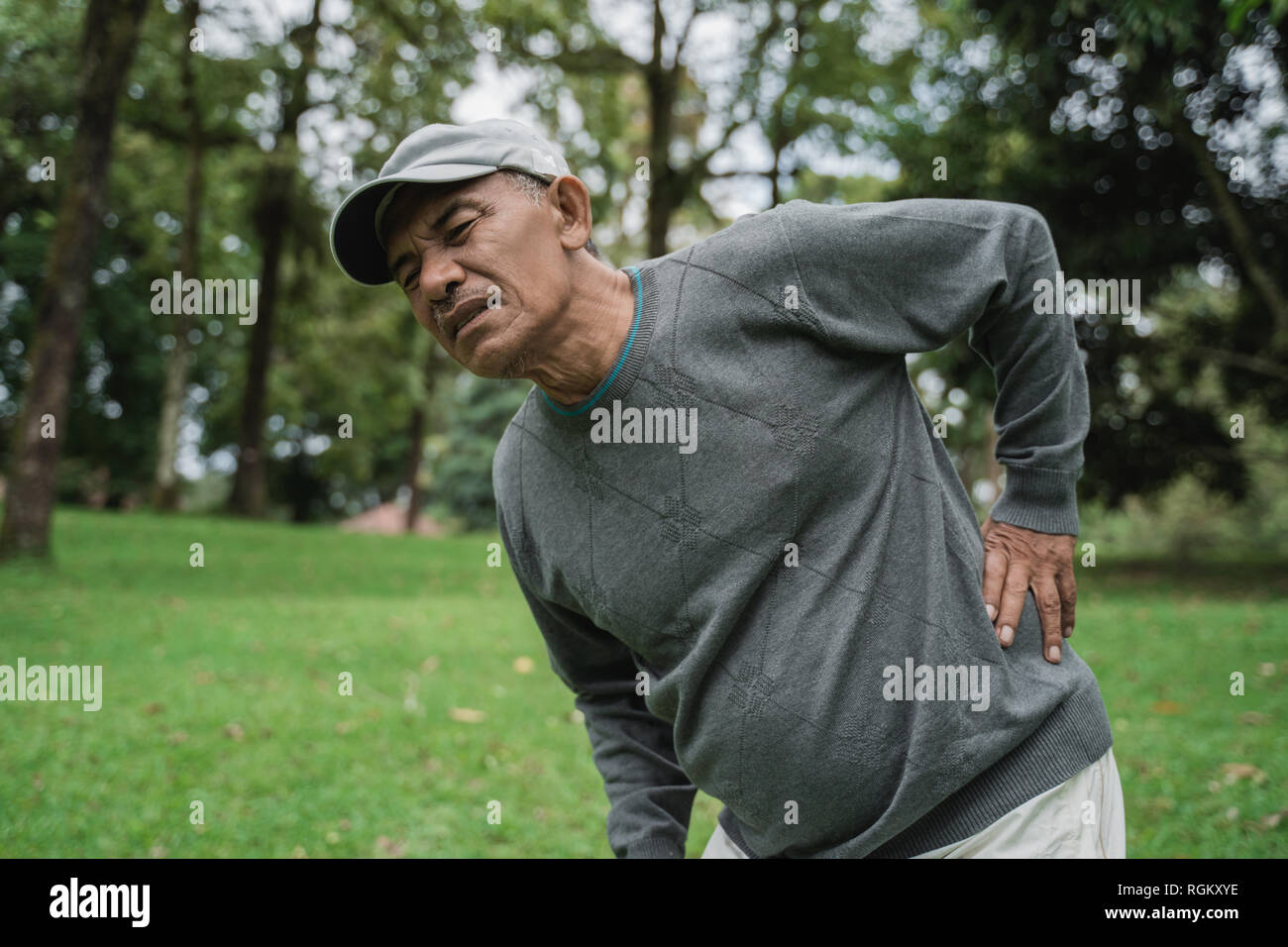 asian senior old man having back pain Stock Photo - Alamy