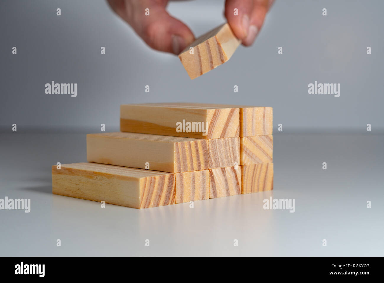 Going up! Block stairs leading to nowhere with a hand that puts a new ...