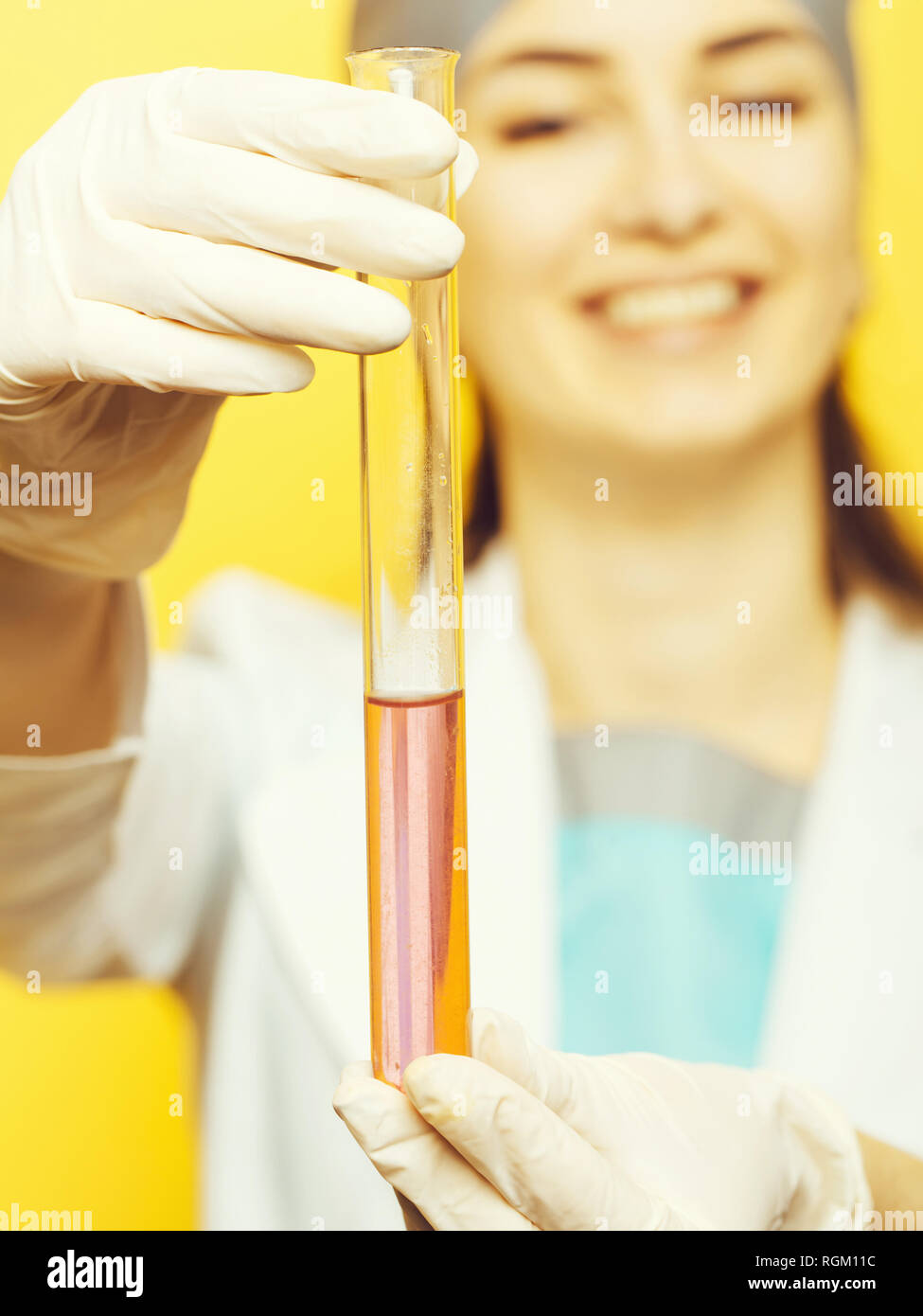 Female scientist with flask Stock Photo - Alamy