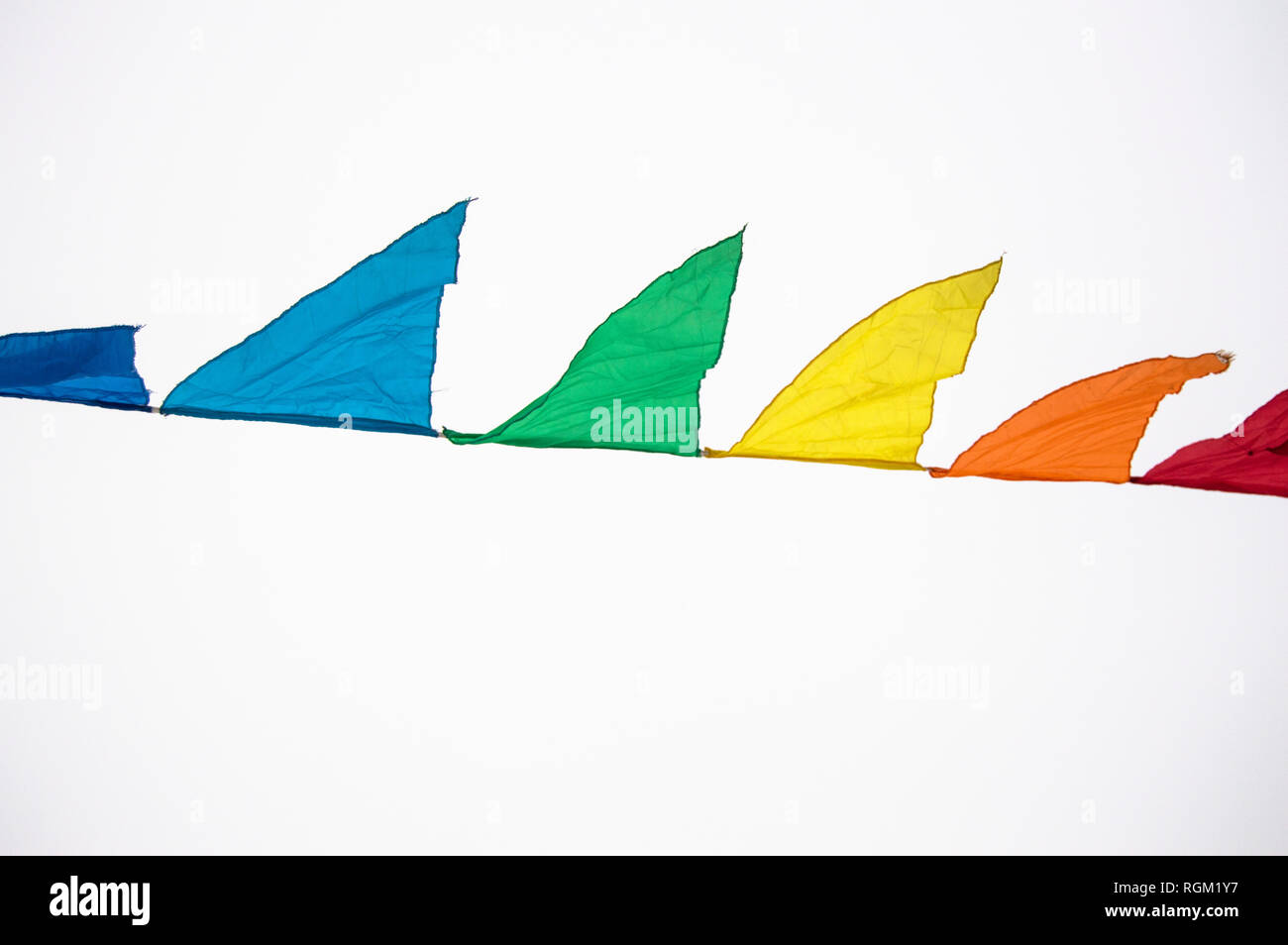 Colorful multicolored triangular flags, isolated on a white background ...