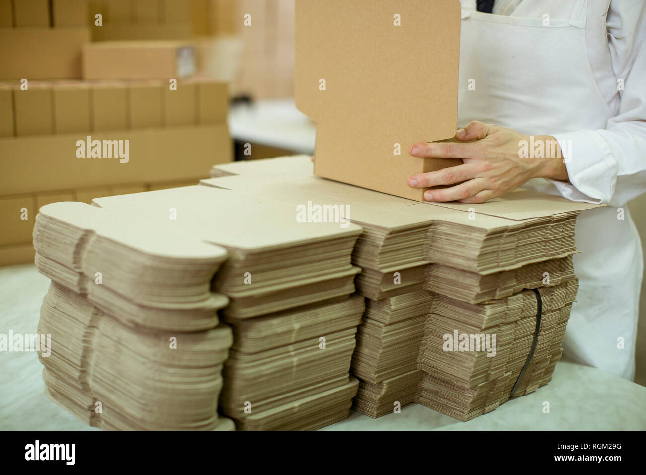 Person at work in a cookies factory Stock Photo - Alamy