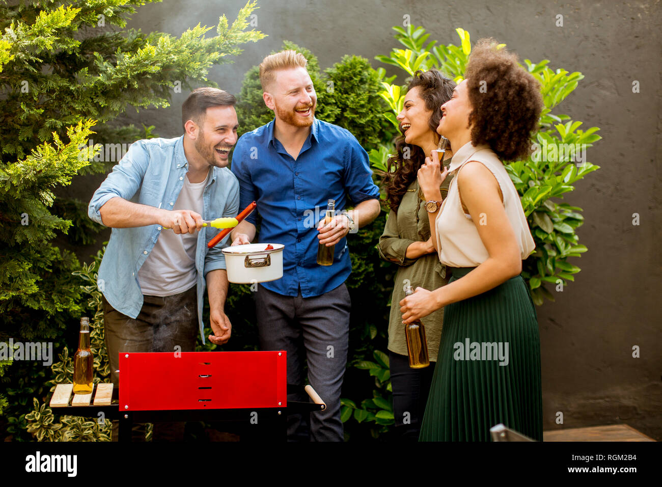 Positive male friends enjoying hi-res stock photography and images - Alamy