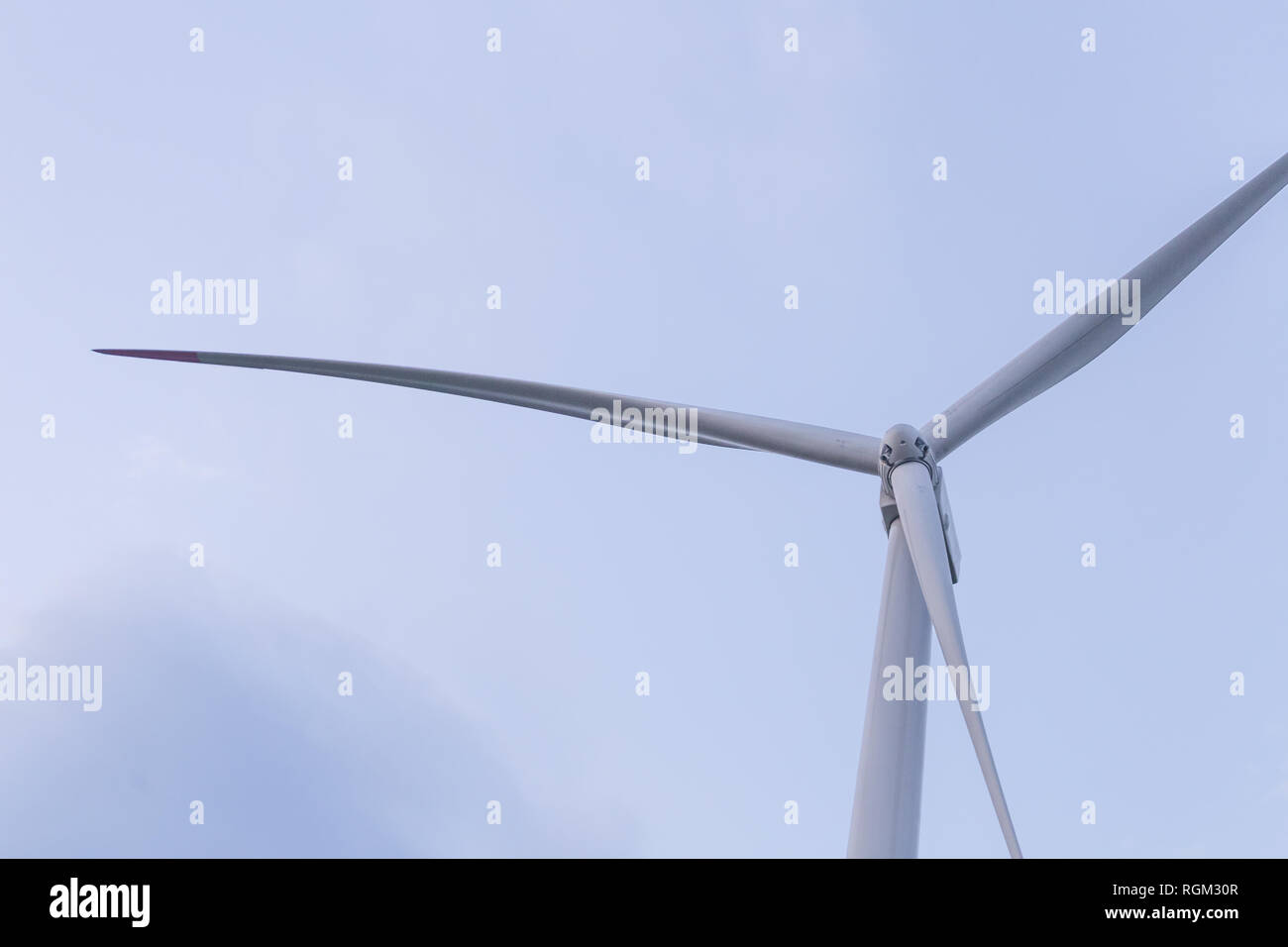 One windmill turbine top at blue cloudy sunset sky Stock Photo - Alamy