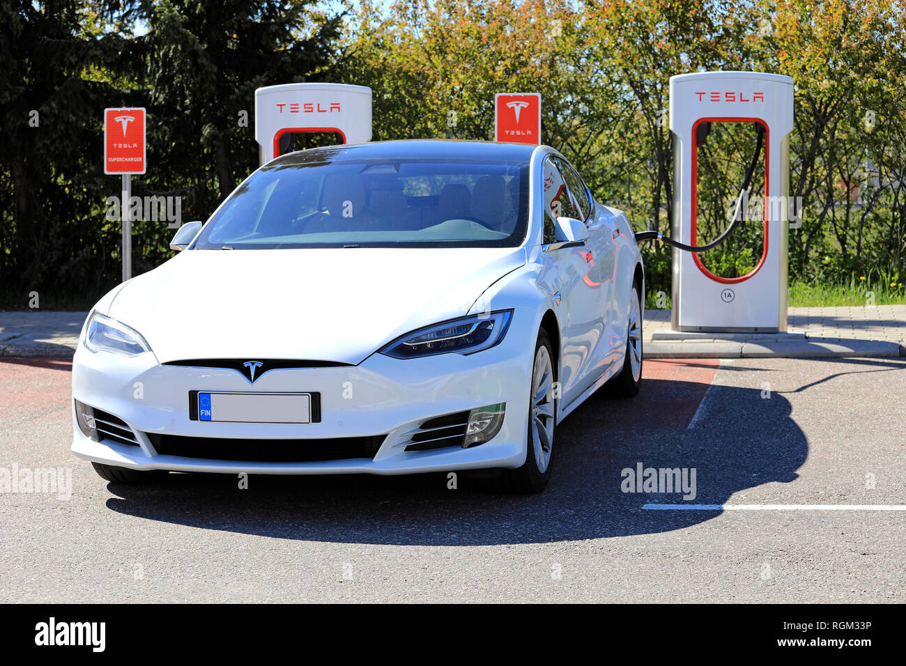 PAIMIO, FINLAND - JUNE 3, 2017: White Tesla Model S luxury electric car ...