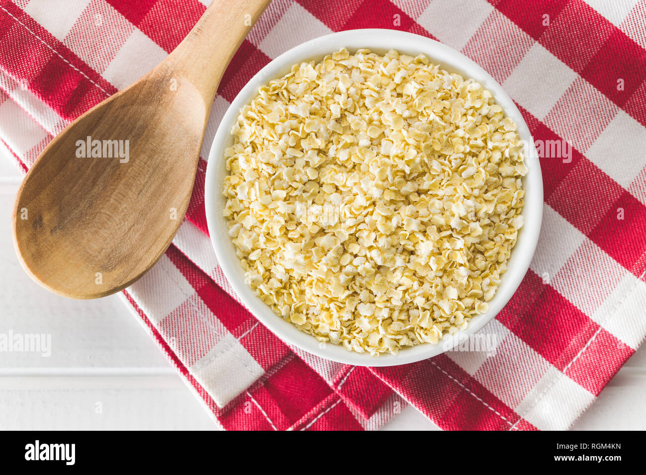 Healthy millet flakes in bowl Stock Photo - Alamy