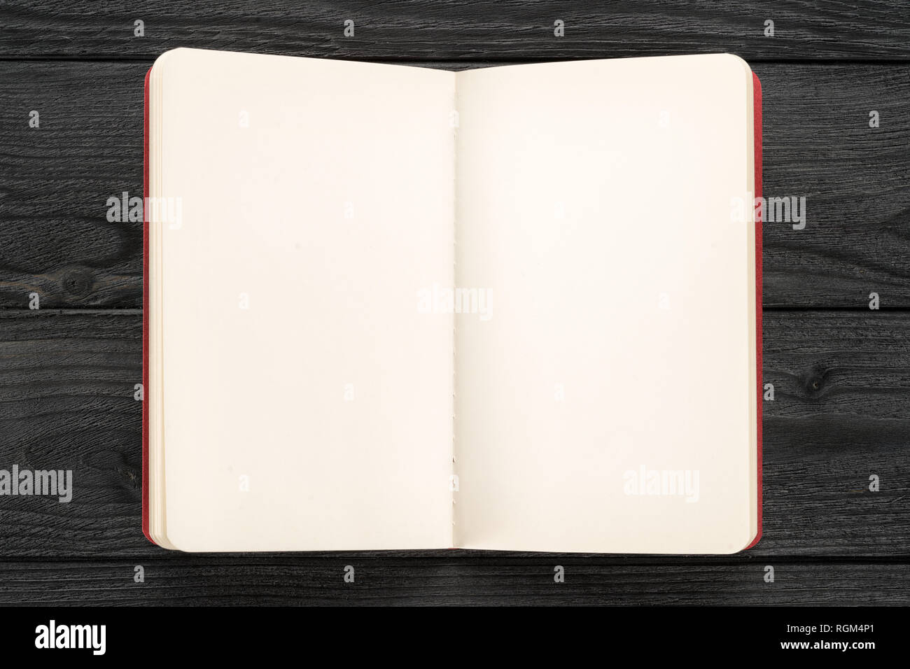 Open note on black wooden table top view. Template and background Stock ...
