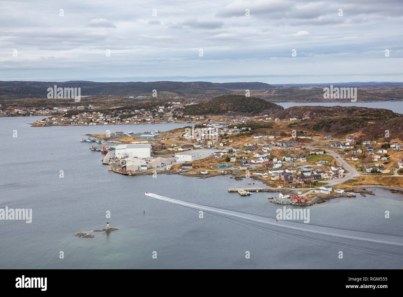 Aerial view of a town on the Rocky Atlantic Ocean Coast during a cloudy ...