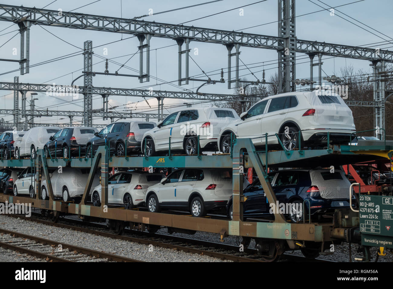 New Volkswagen cars on a freight train at train station, Slovenia Stock ...