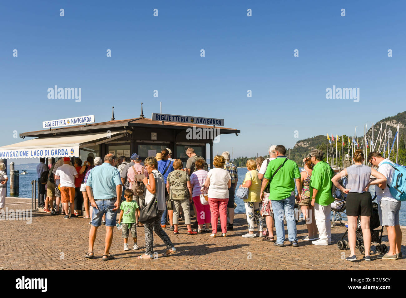 GARDA, ITALY - SEPTEMBER 2018: Long queue of people queuing to buy ...
