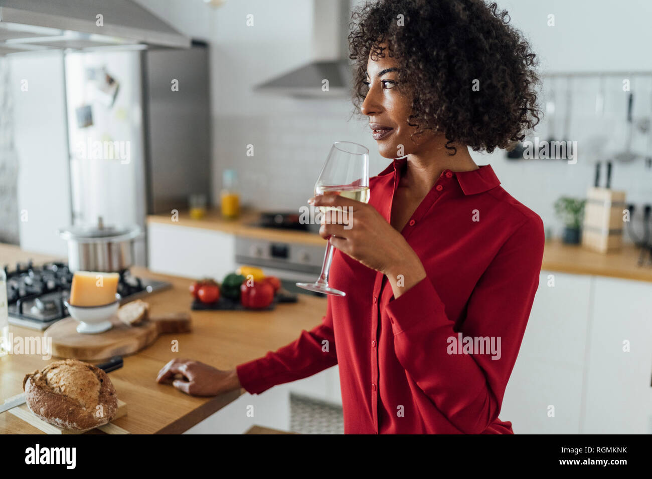Woman drinking white wine kitchen hi-res stock photography and images ...