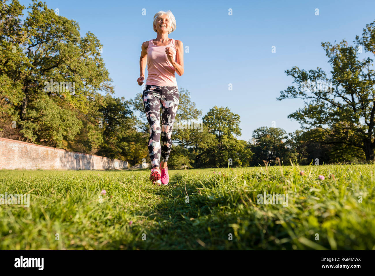 Older woman running hi-res stock photography and images - Alamy