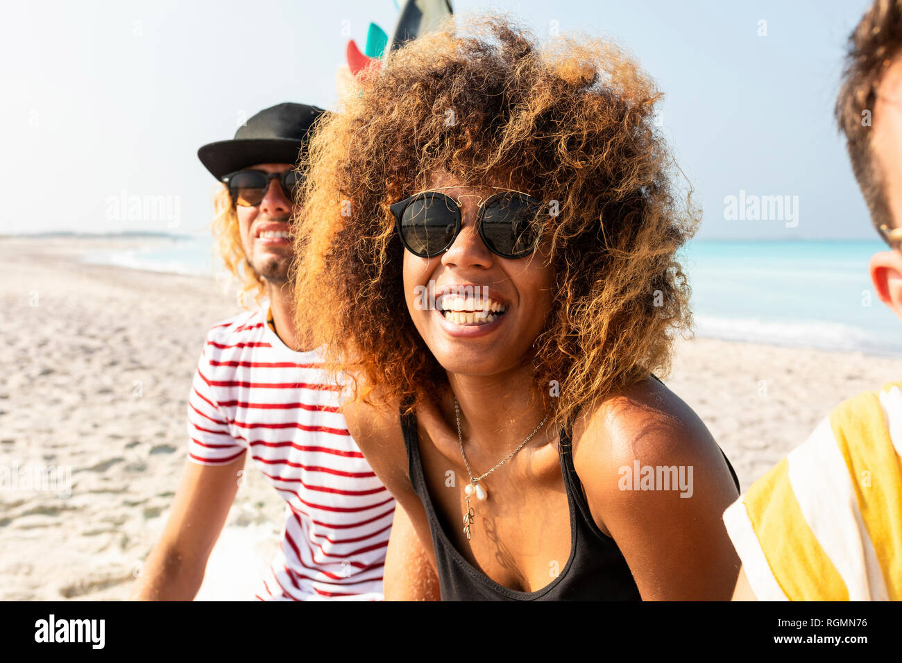 Group of friends having fun on the beach Stock Photo - Alamy