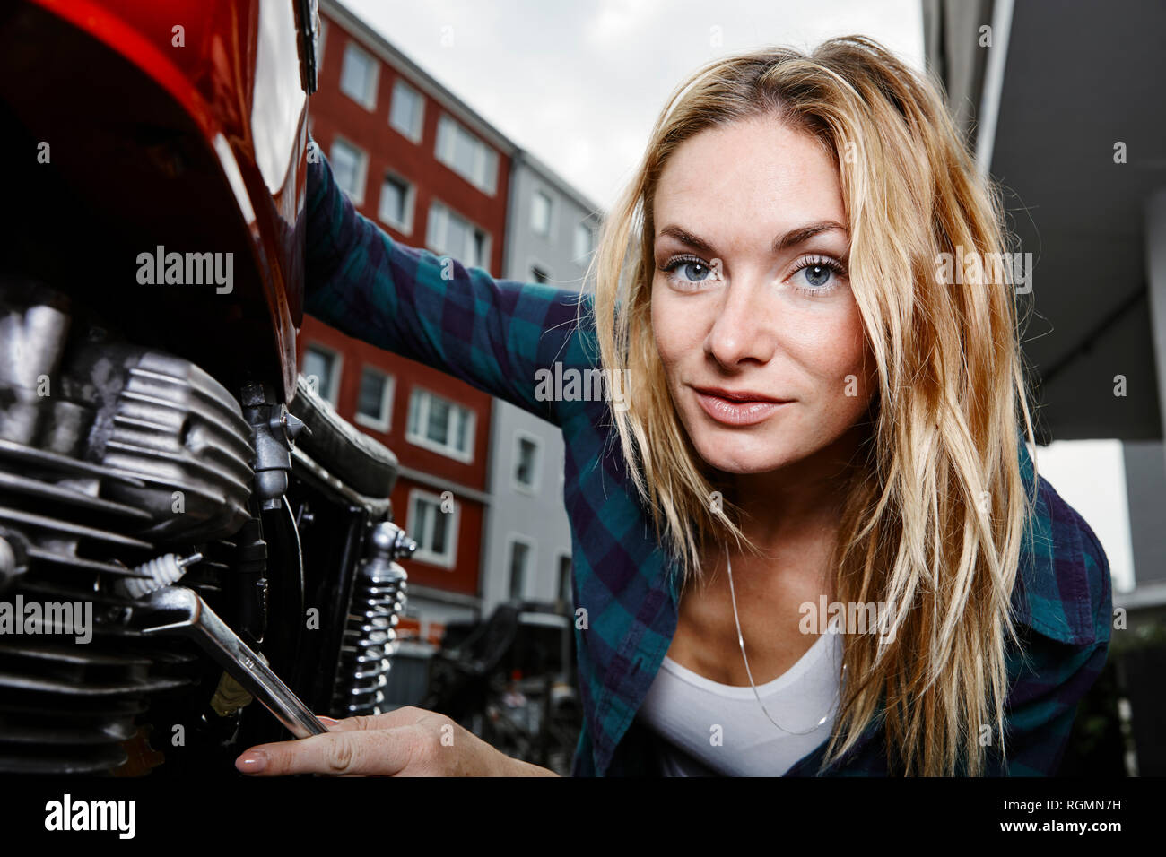 Woman working on motorcycle hi-res stock photography and images - Alamy