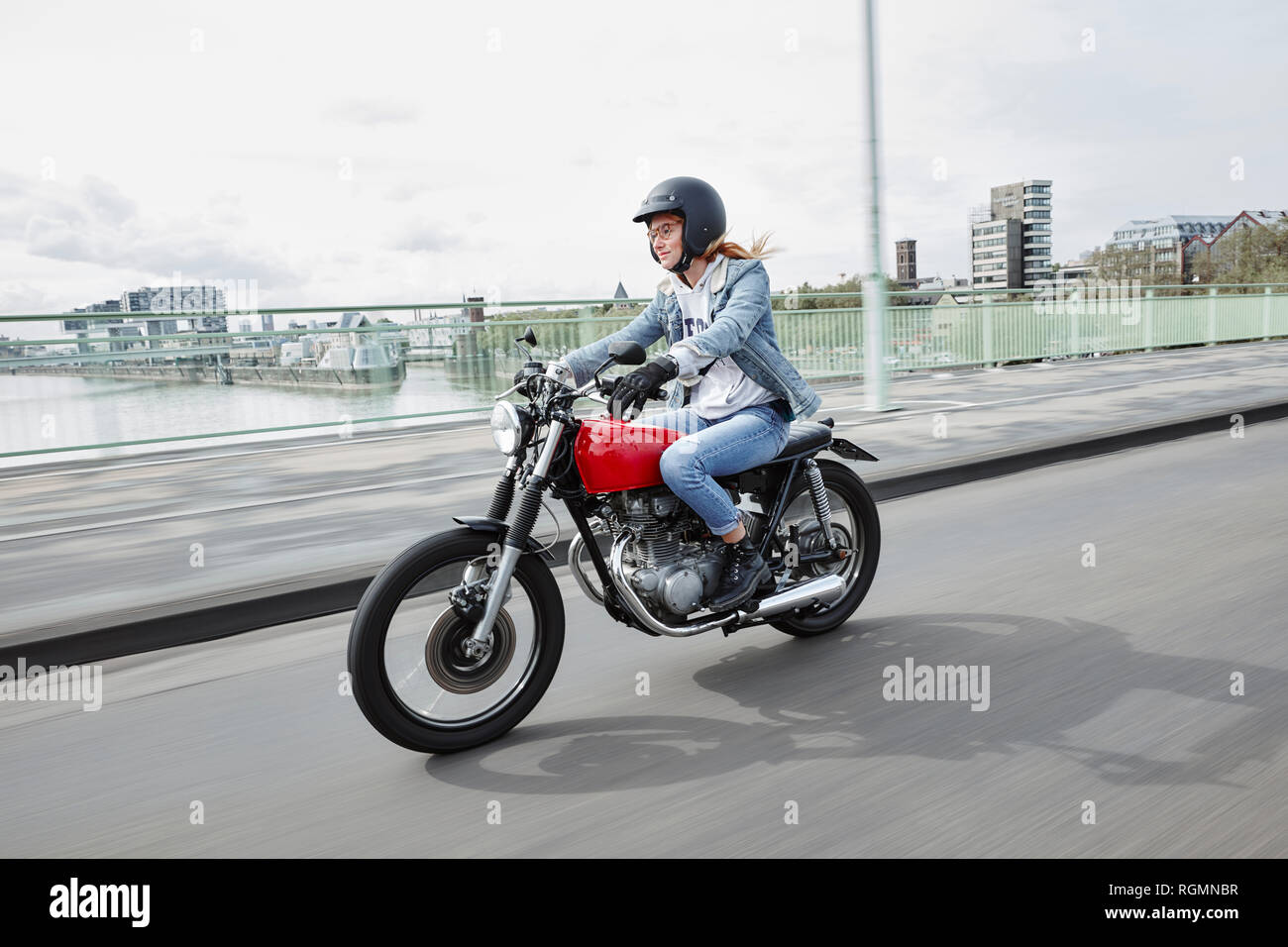 Woman riding on back motorcycle hi-res stock photography and images - Alamy