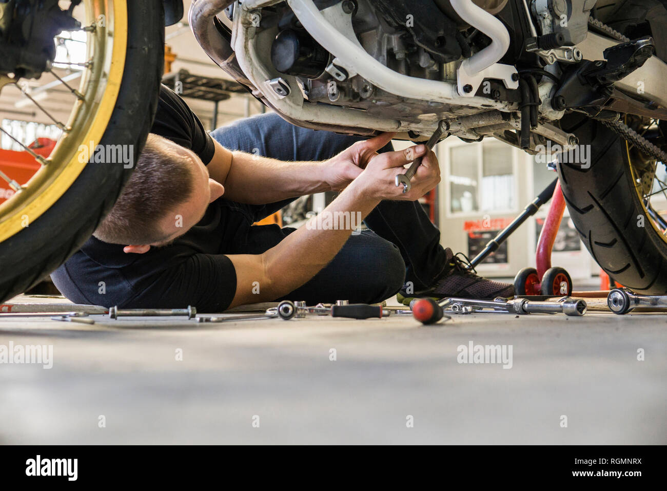 Two men repair motorcycle hi-res stock photography and images - Alamy