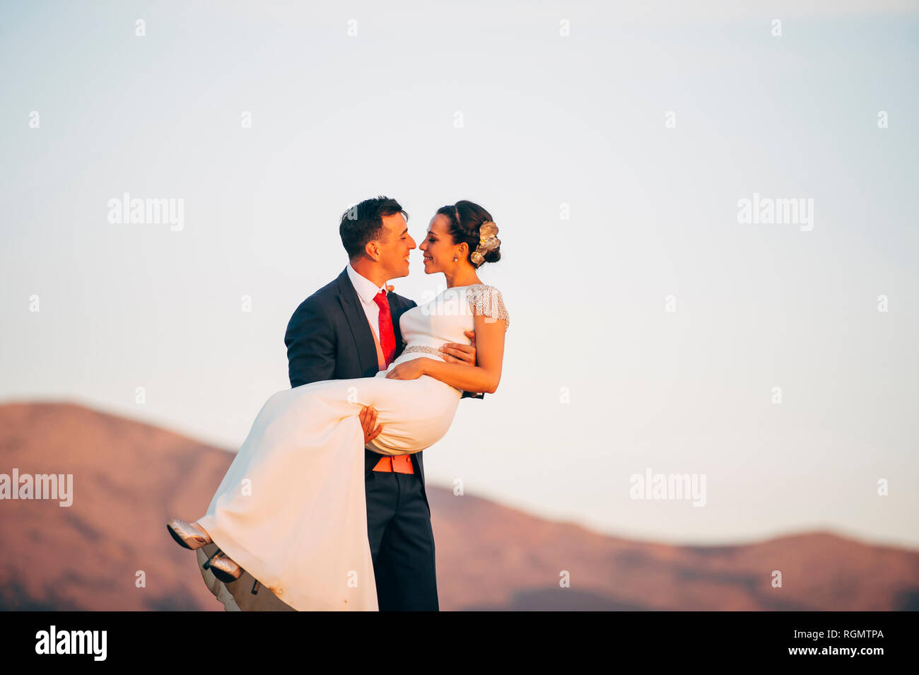 Carrying bride hi-res stock photography and images - Alamy