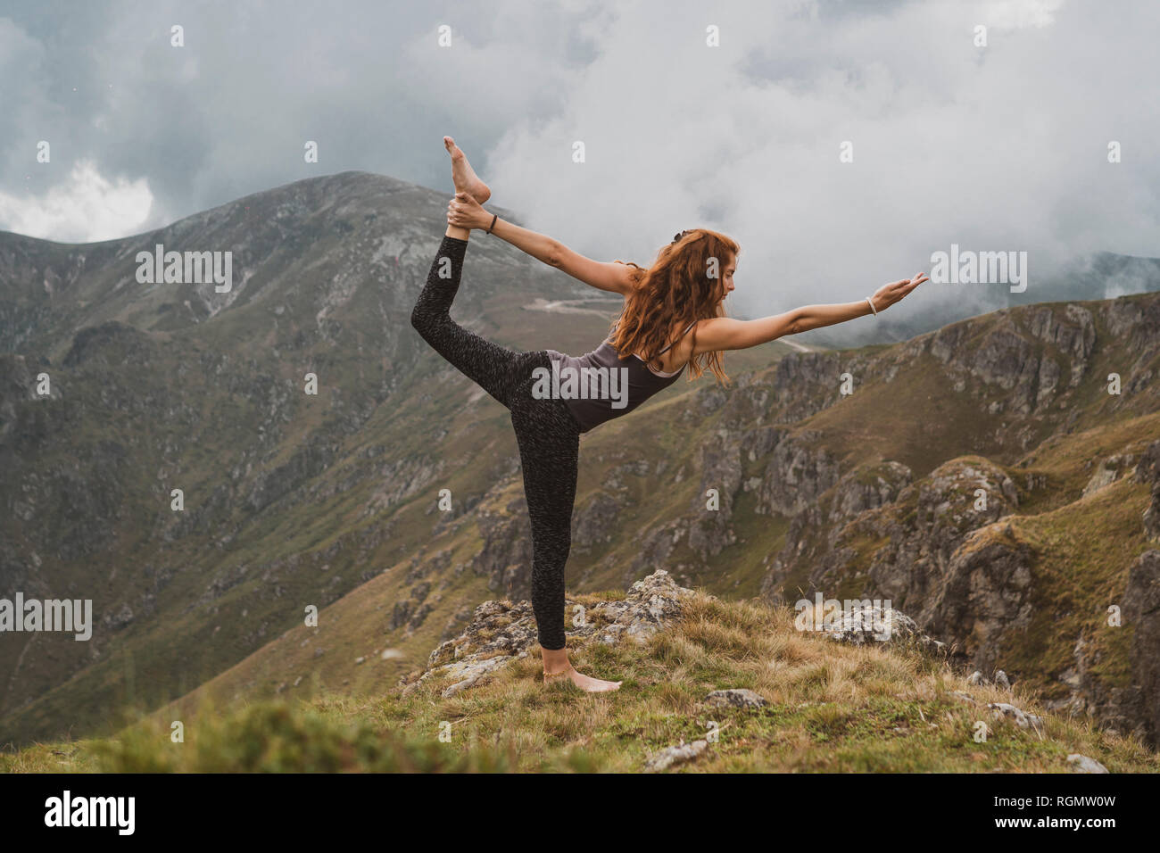 Woman standing doing yoga exercises hi-res stock photography and images ...