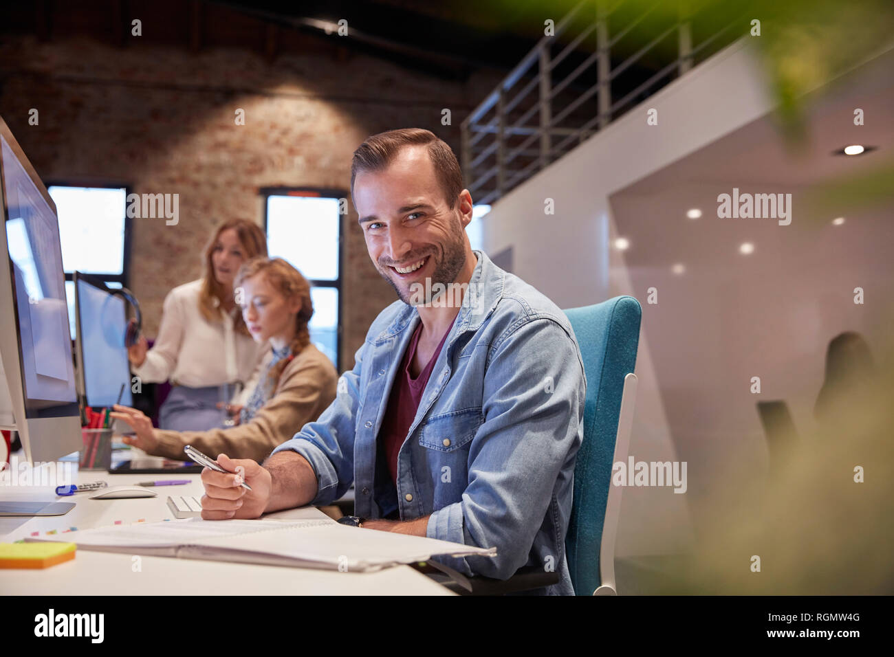 Man 50 desk looking at camera hi-res stock photography and images - Alamy