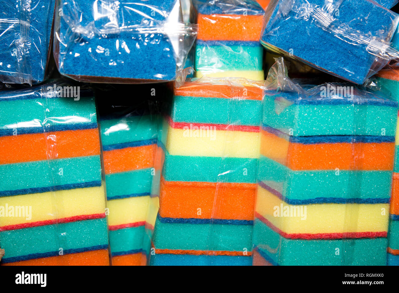 multi-colored sponges in packing in a warehouse, dishwashing sponges ...