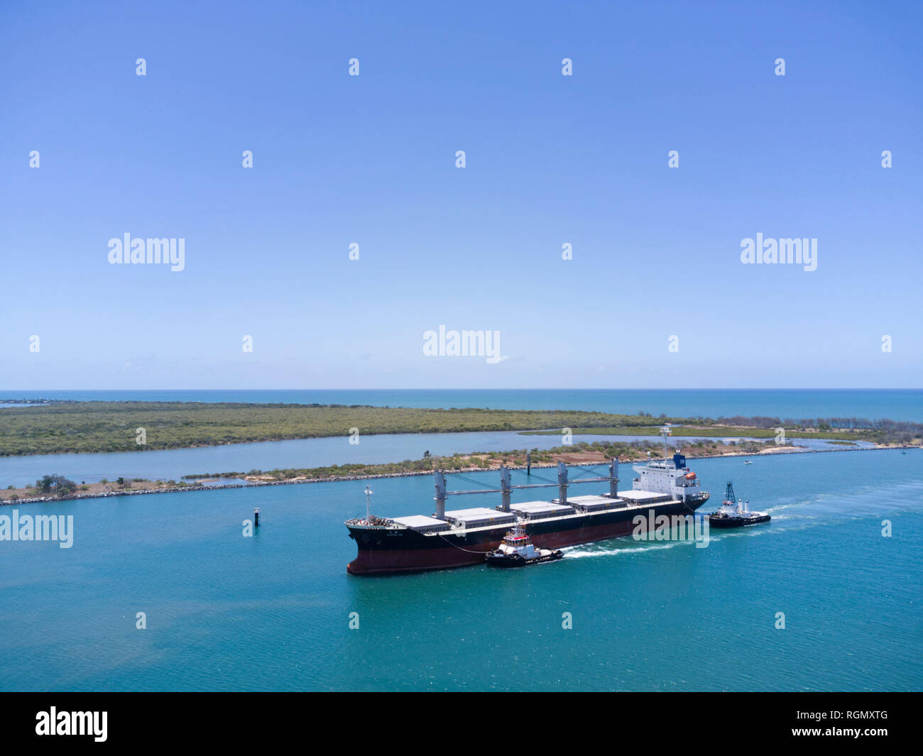 Aerial bulk carrier ship on the Burnett River berthing at the sugar ...