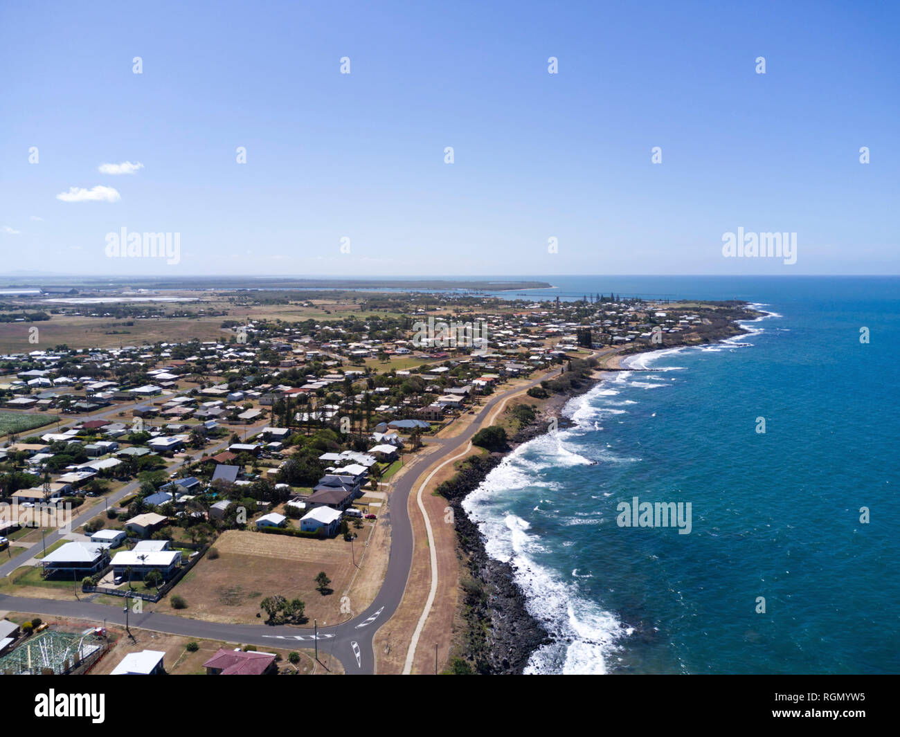 Aerial of houses in the coastal community of Burnett Heads on the coast ...