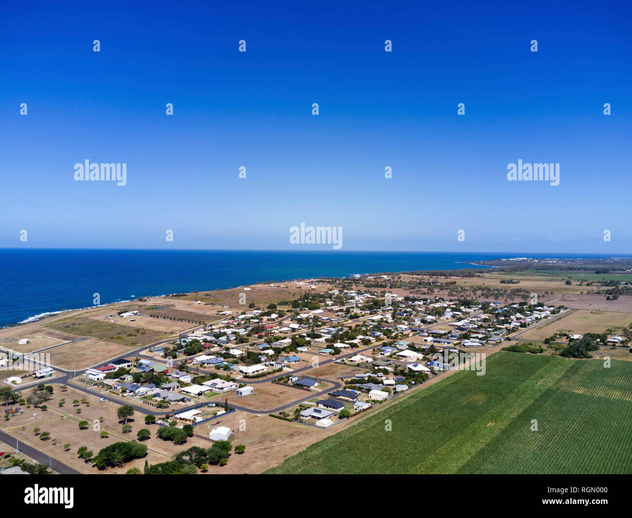 Aerial of the coastal community of Burnett Heads near Bundaberg ...