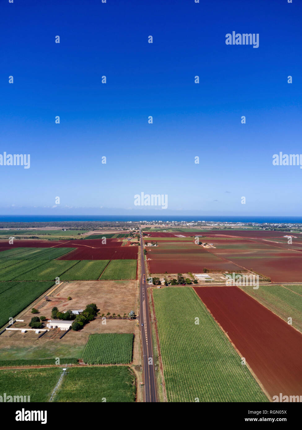 Aerial of the volcanic plug known as The Hummock is surrounded by rich ...