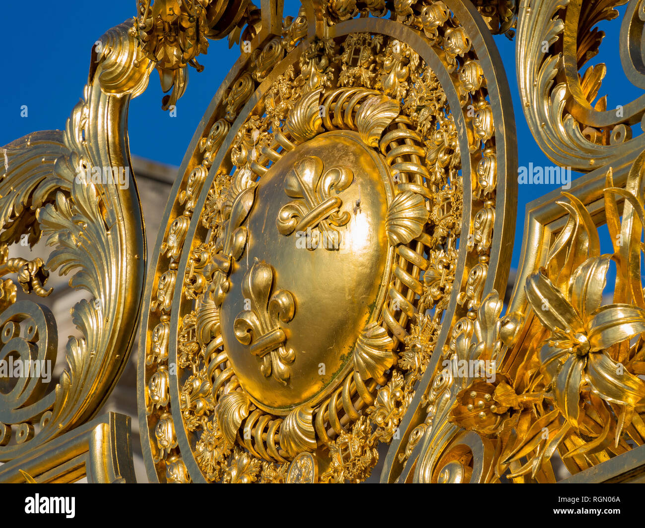 The golden entrance gate of the famous Palace of Versailles at France ...
