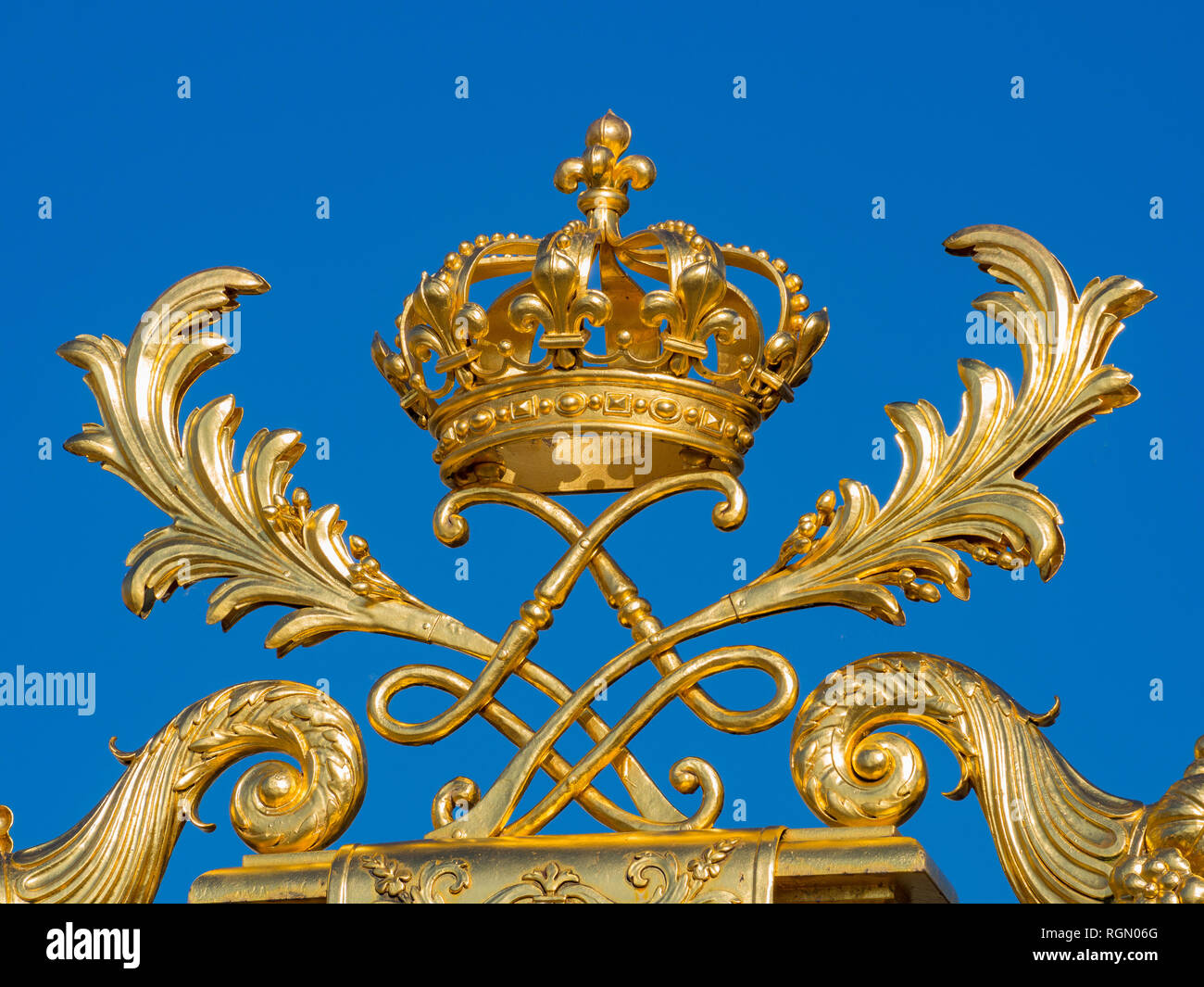 The golden entrance gate of the famous Palace of Versailles at France ...