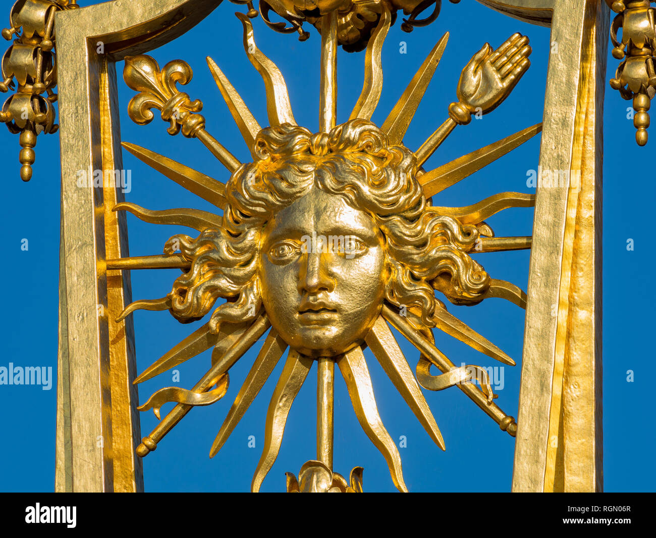 The golden entrance gate of the famous Palace of Versailles at France ...