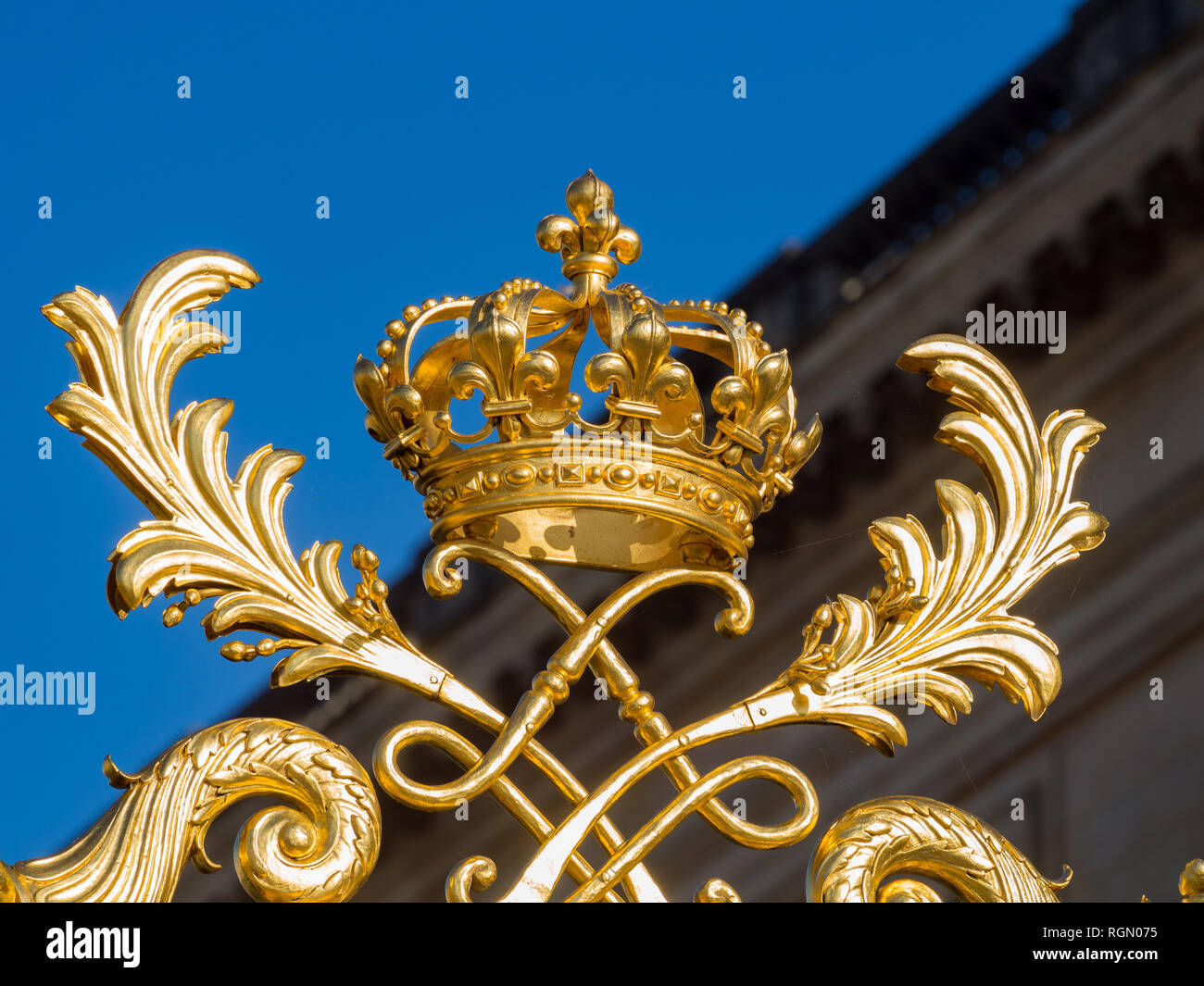 The golden entrance gate of the famous Palace of Versailles at France ...
