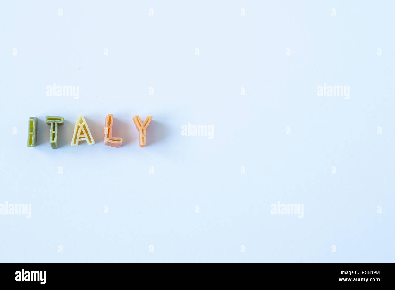 The word "Italy" composed with real pasta letters in the italian flag ...