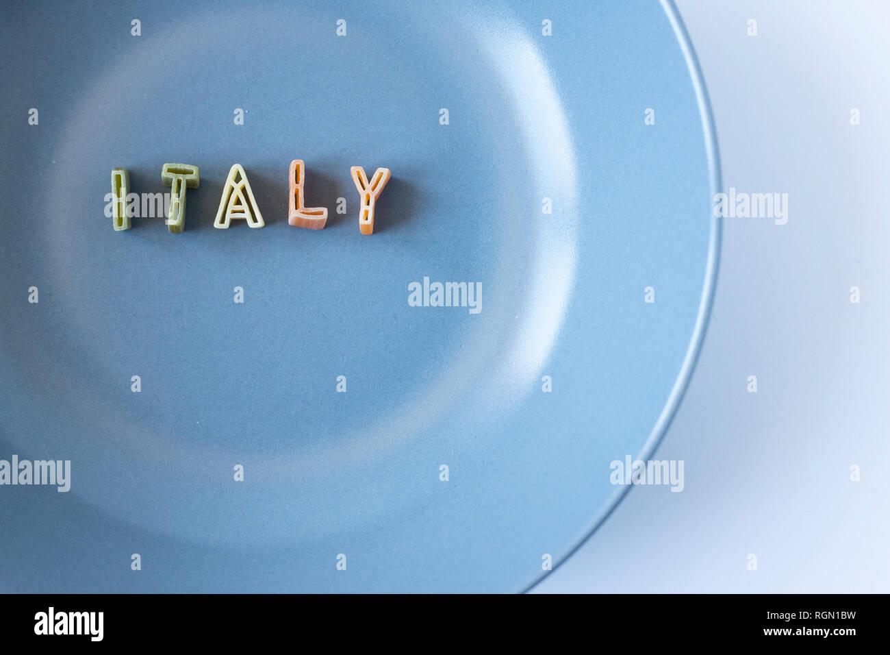 The word "Italy" composed with real pasta letters in the italian flag ...