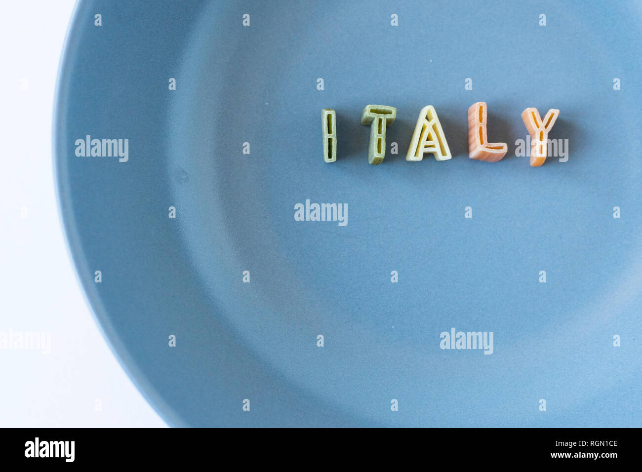 The word "Italy" composed with real pasta letters in the italian flag ...