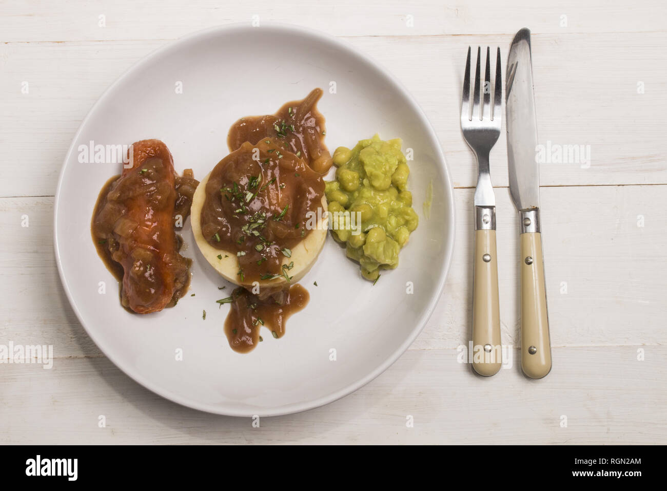 very typical irish dish, mashed potato, onion gravey, grilled sausages ...