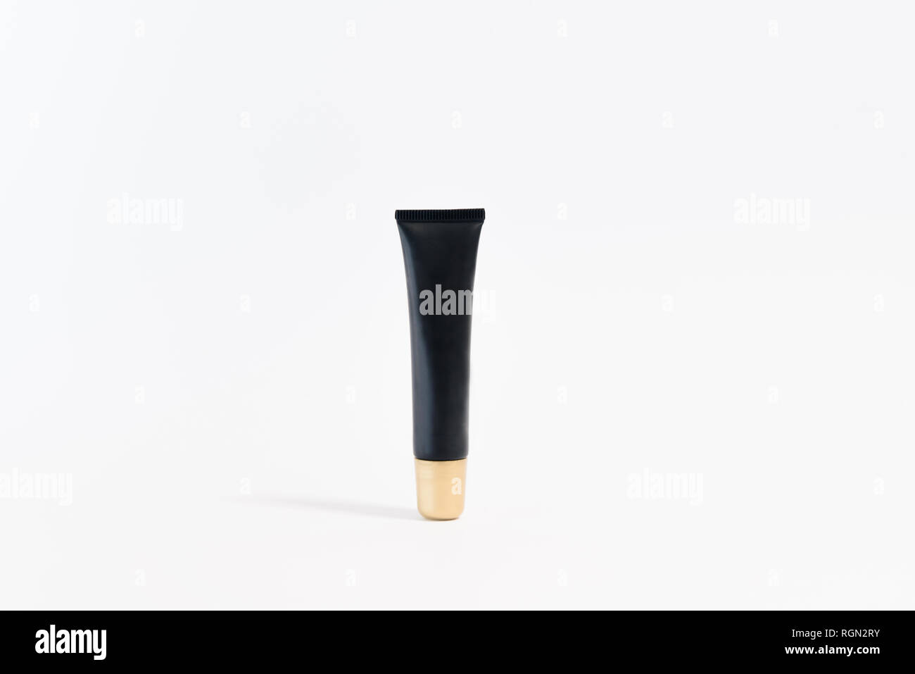 Blank plastic hand cream bottle on white background. Copy space for ...