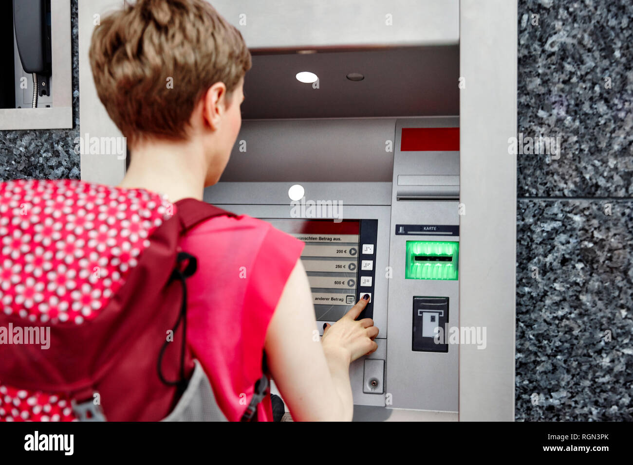 Using the cash machine hi-res stock photography and images - Alamy