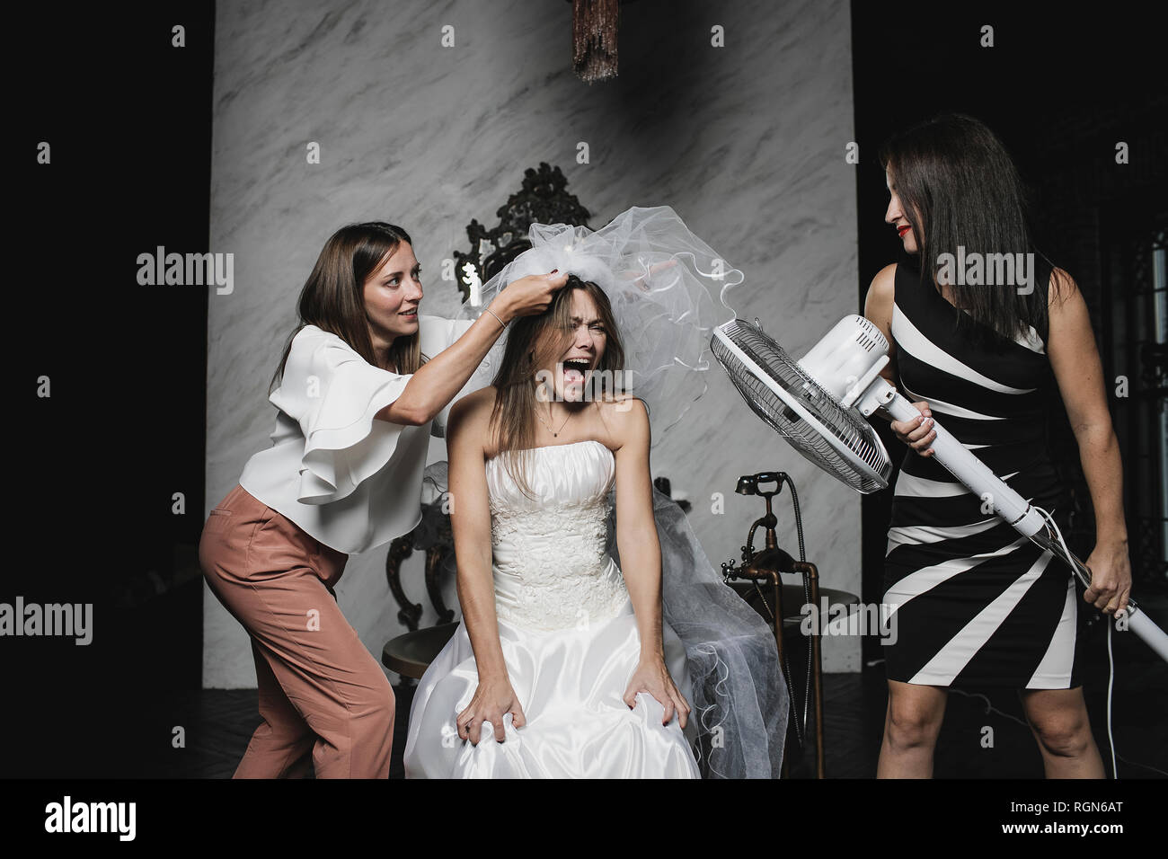 Playful friends and bride during wedding preparation Stock Photo - Alamy