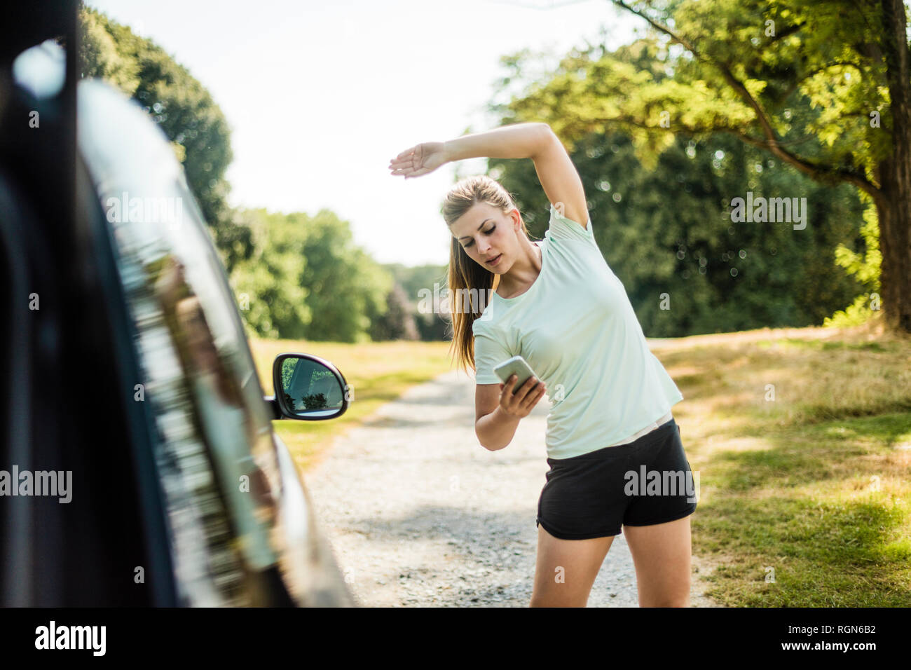 Stretching young woman hi-res stock photography and images - Alamy