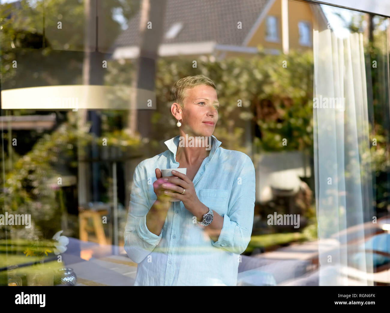 Woman reflected window hi-res stock photography and images - Alamy